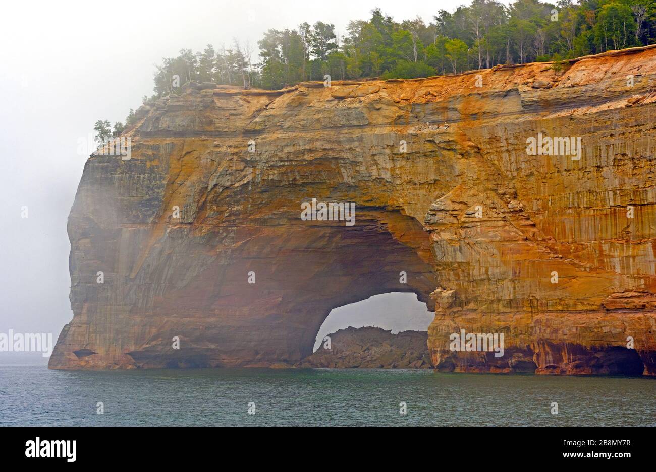 Sandstone Sea Arch in the Fog in Pictured Rocks National Lakeshore on ...