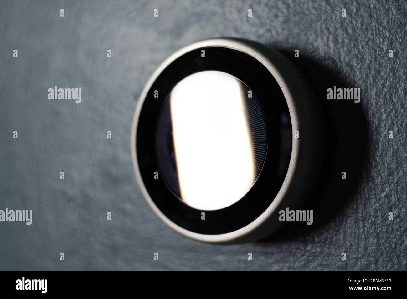 Thermostat in smart home. Technology with glare in center obstructing ...