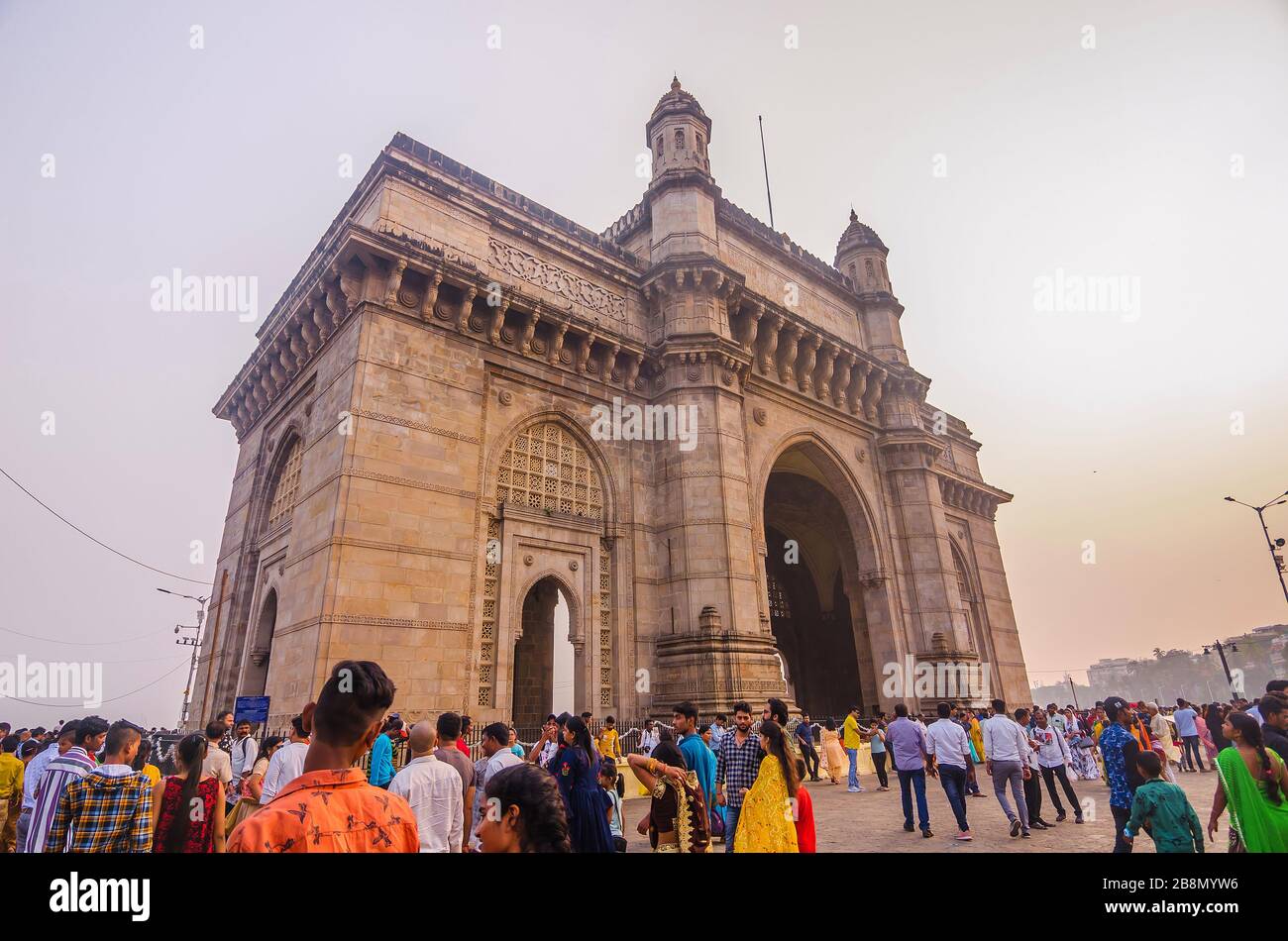 MUMBAI, INDIA – DEC. 8, 2019: Visitors enjoying near Gateway of India ...