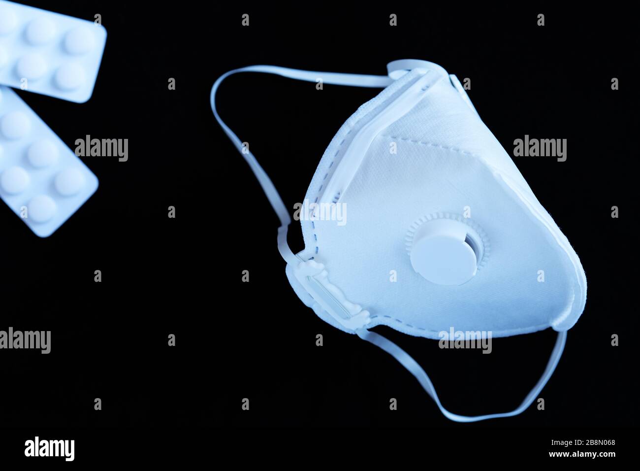 A non reusable sterile white ffp3 mask with valve with painkillers such ...