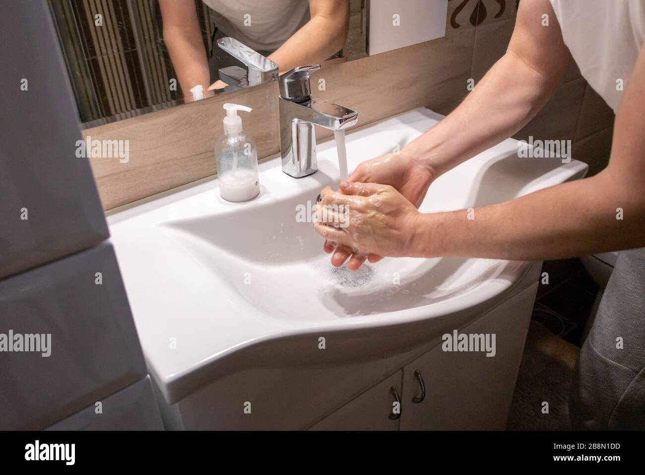 Washing of hands with soap under running water Stock Photo - Alamy