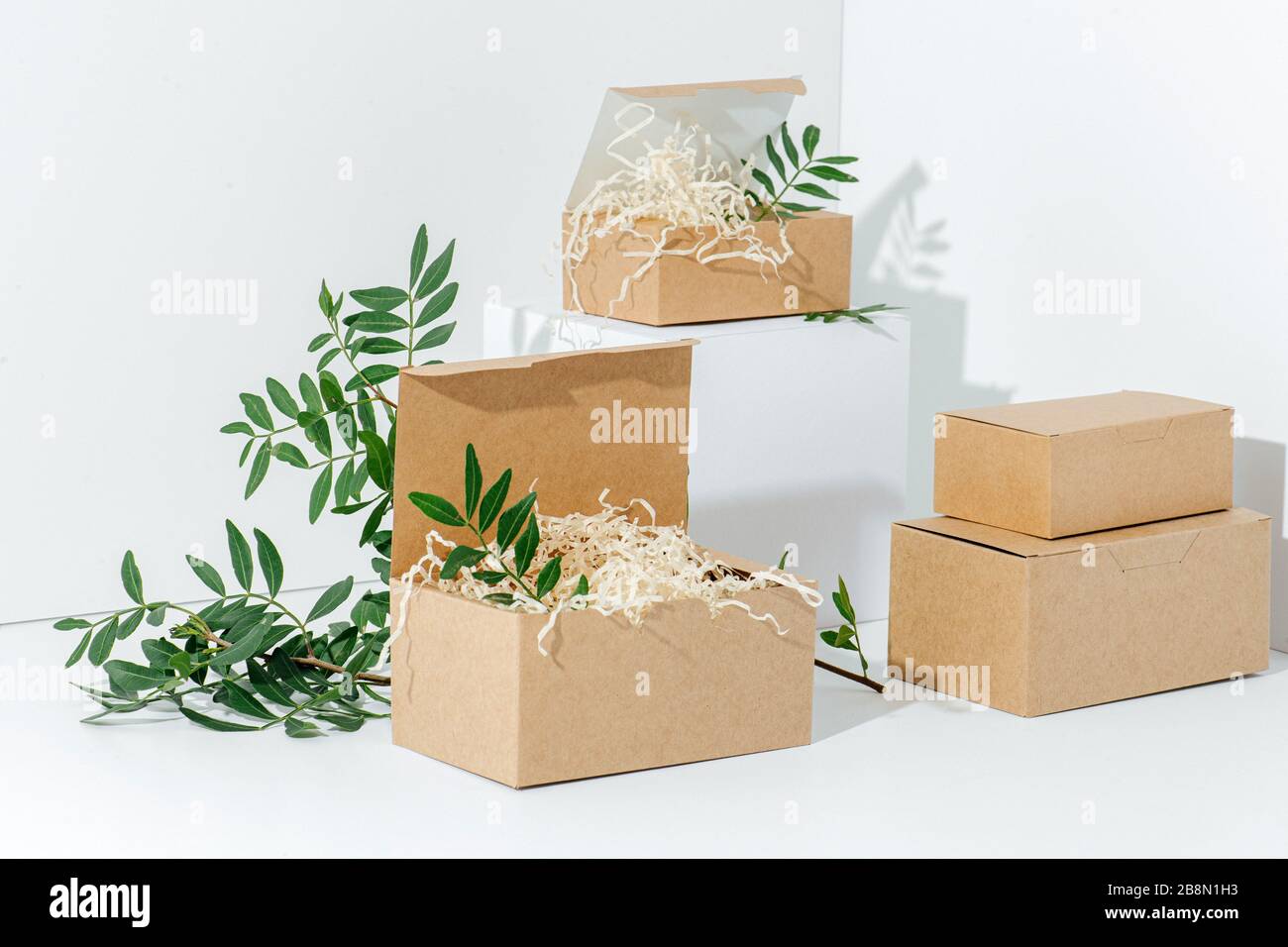 Recyclable paper boxes in the corner over white background Stock Photo ...