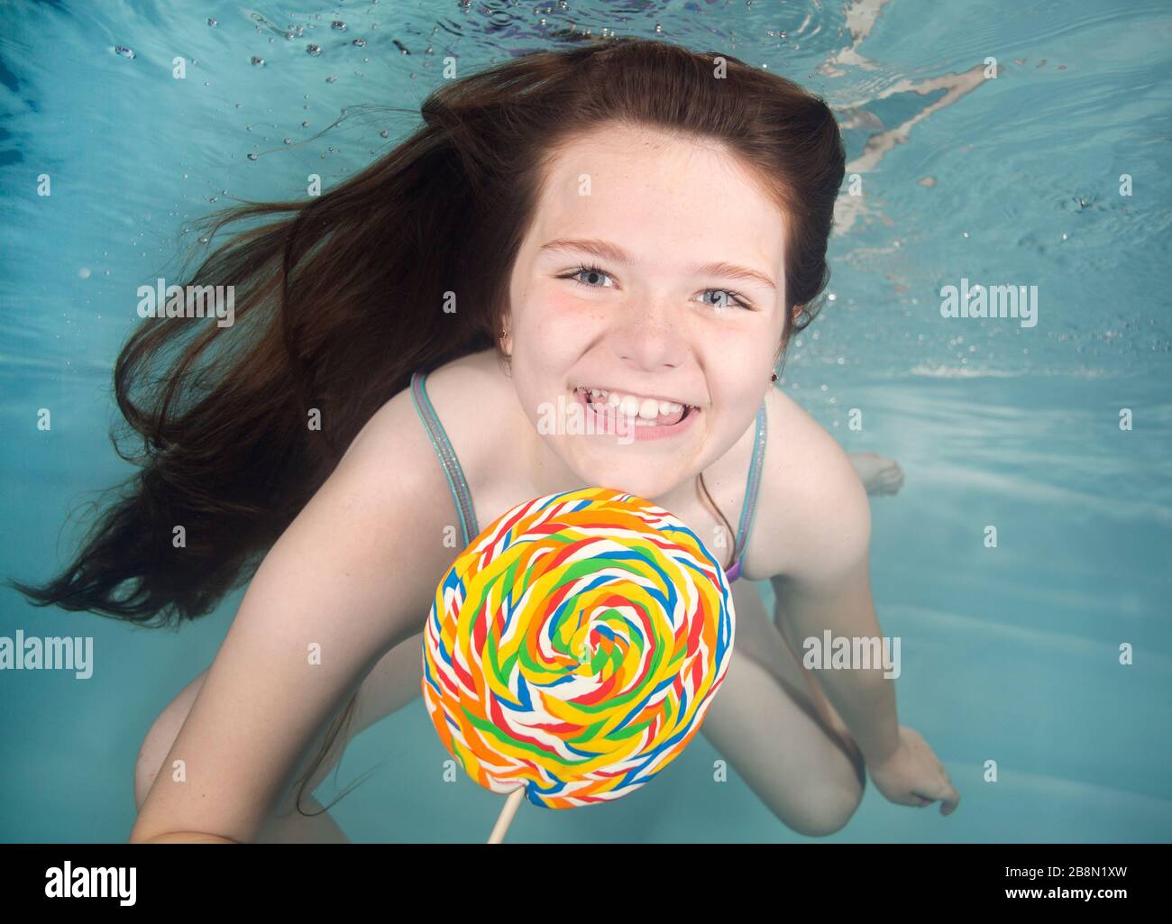 Girl Swimming Underwater Stock Photo - Alamy