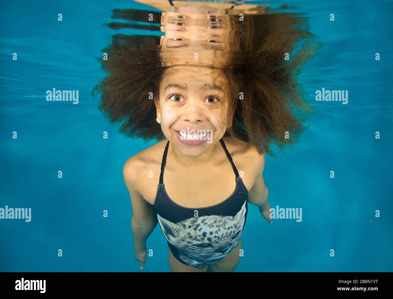 Girl Swimming Underwater Stock Photo - Alamy