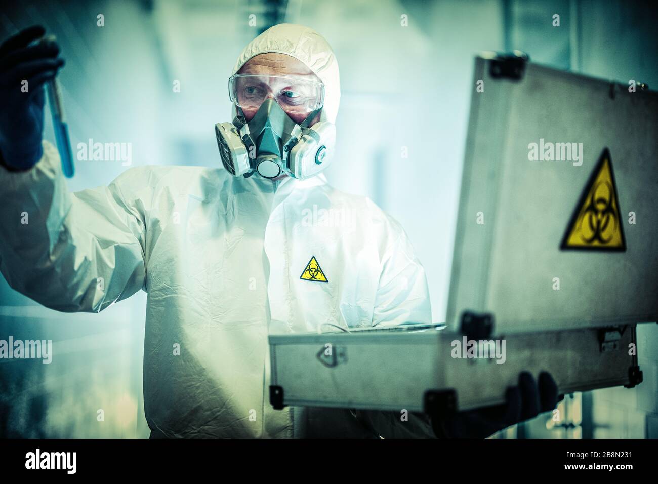 corona virus concept. male doctor holding biohazard case Stock Photo ...