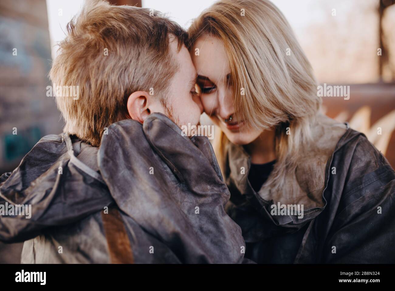 Portrait of couple in love in NBC protective suits and gloves. Concept ...