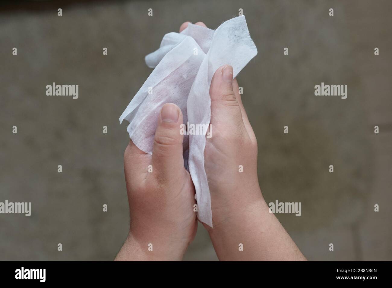 Kid using wet wipe for protection of virus Stock Photo - Alamy