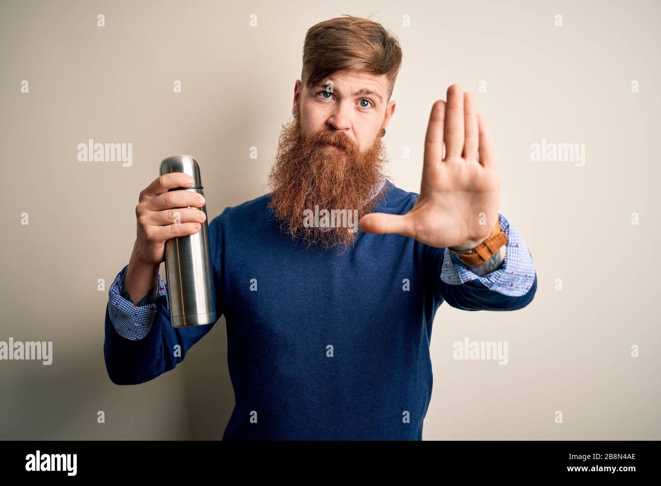 Redhead Irish Man With Beard Holding Takeaway Beverage Thermo Over Isolated Background With Open