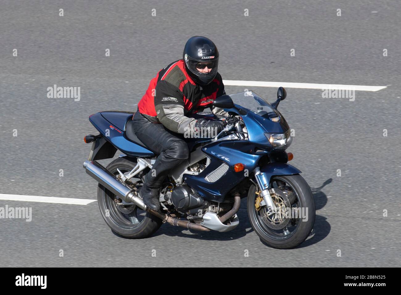 Honda VTR1000F motorbike rider; Vehicular traffic, two wheeled ...