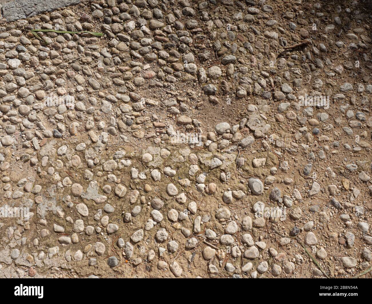 Detail of rounded stones set into original pavement Stock Photo - Alamy