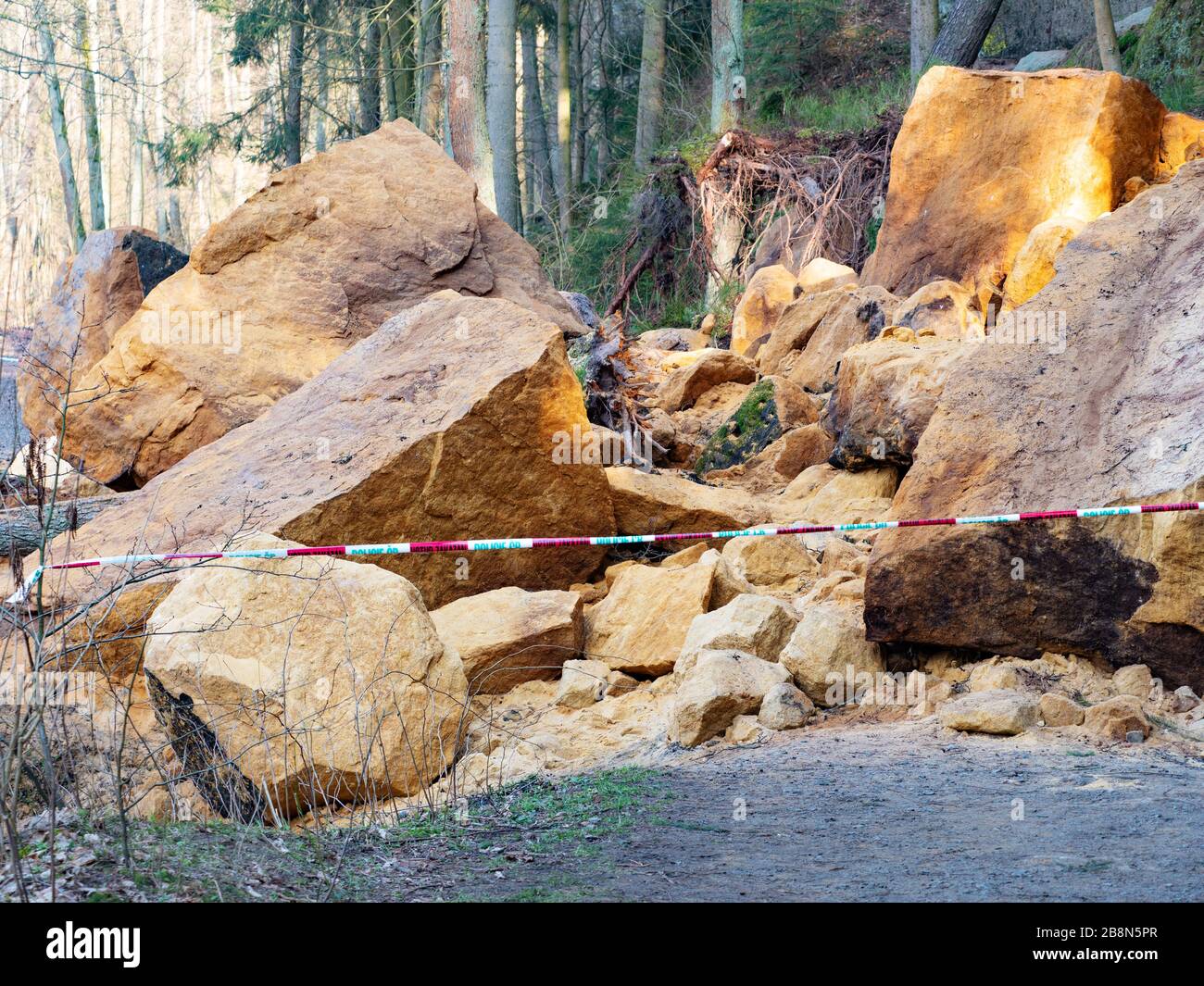 Zone of collapsed rock from the hill. Police closed forest path with ...