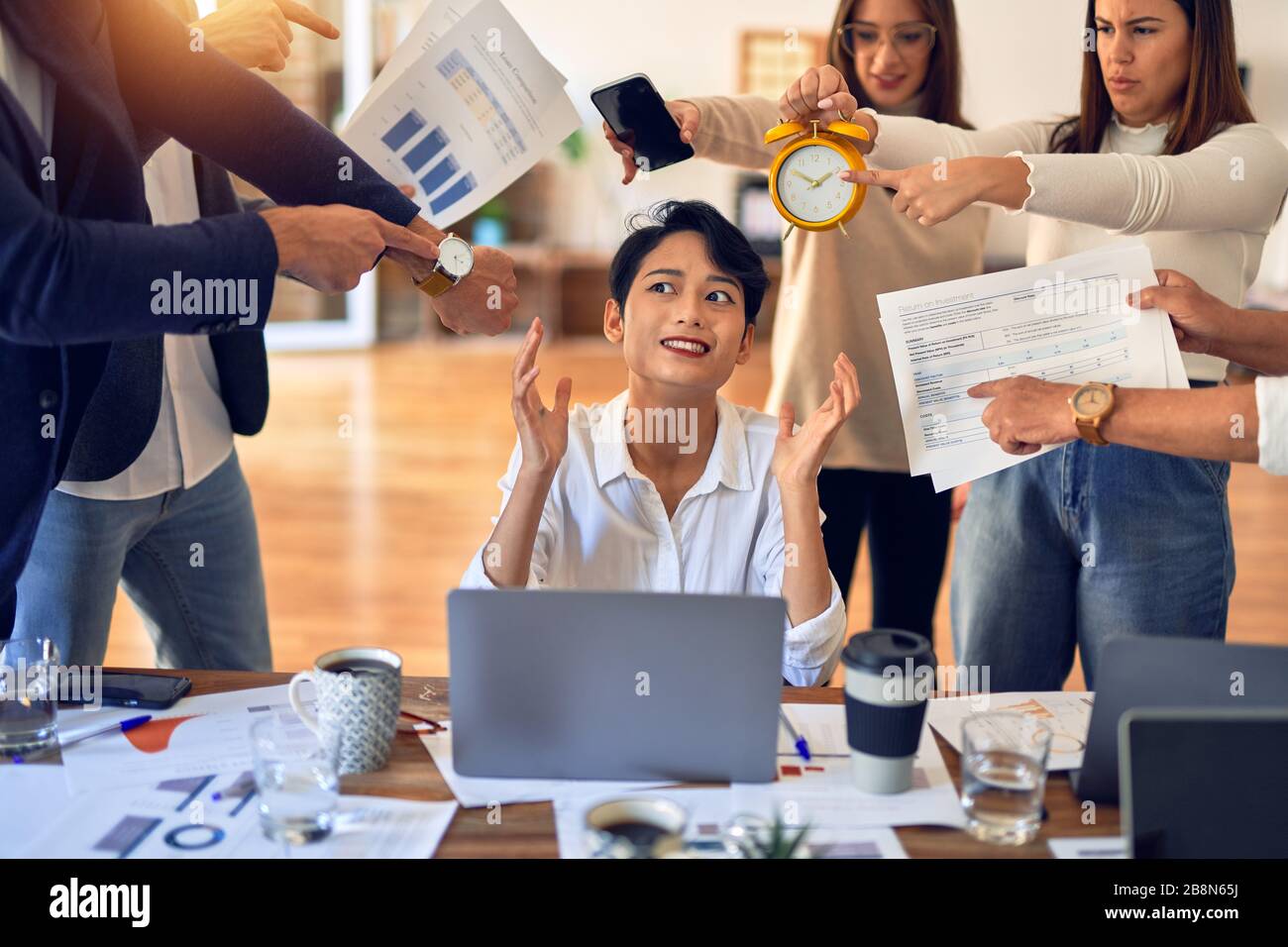 Group of business workers working together. Partners stressing one of ...