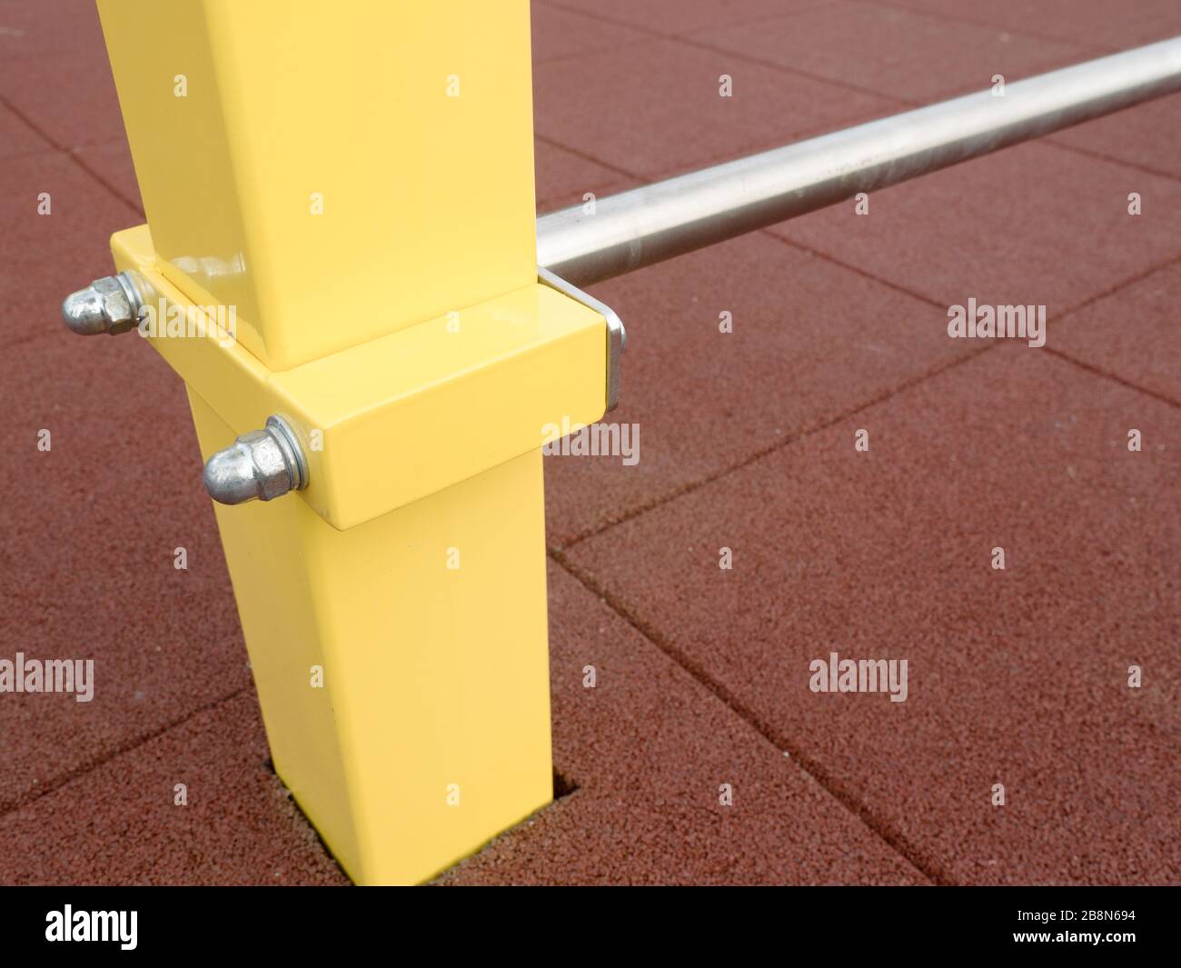 Frame for metal swedish ladder with yellow beams on ablurred dark ...