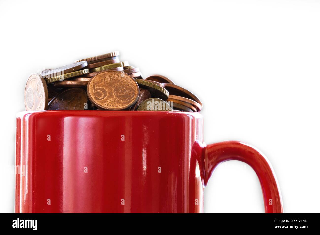 Saved Money in a colorful red mug to Finance Goals overflowing with ...