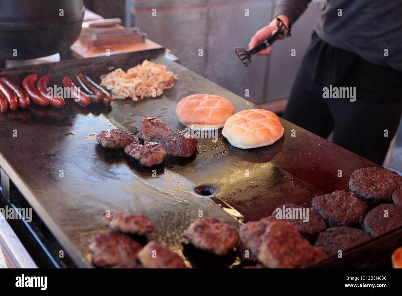 Chef making beef burgers outdoor on open kitchen international food ...