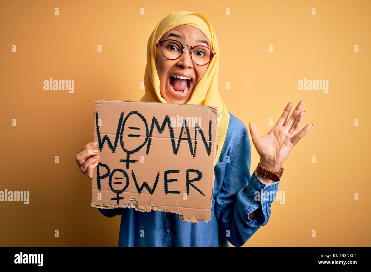 Beautiful woman with curly hair wearing muslim hijab asking for women ...