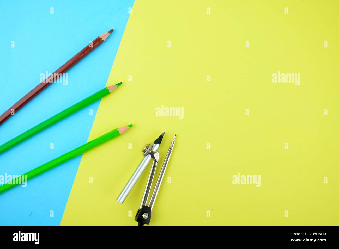 Some different colored pencil crayons and a silver pencil attached to a ...