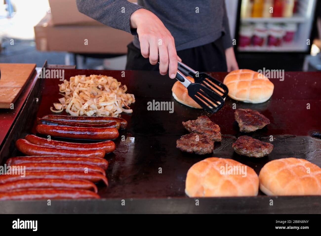 Chef making beef burgers outdoor on open kitchen international food ...