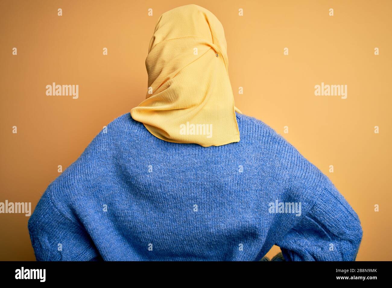Young beautiful brunette muslim woman wearing arab hijab over isolated ...