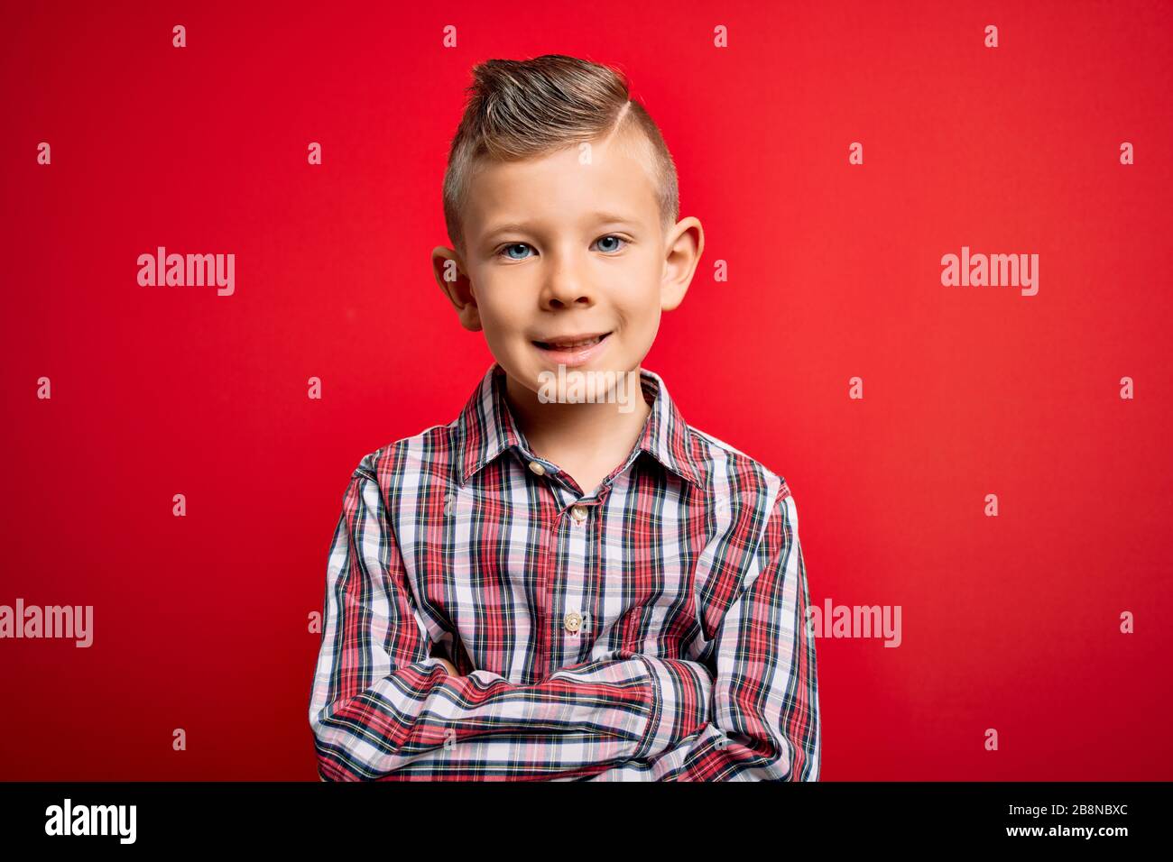 Young little caucasian kid with blue eyes standing wearing elegant ...