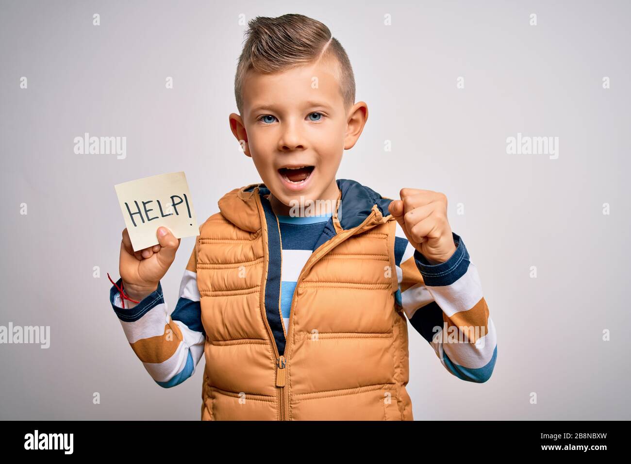 Young little caucasian kid asking for help on a paper note as violence ...