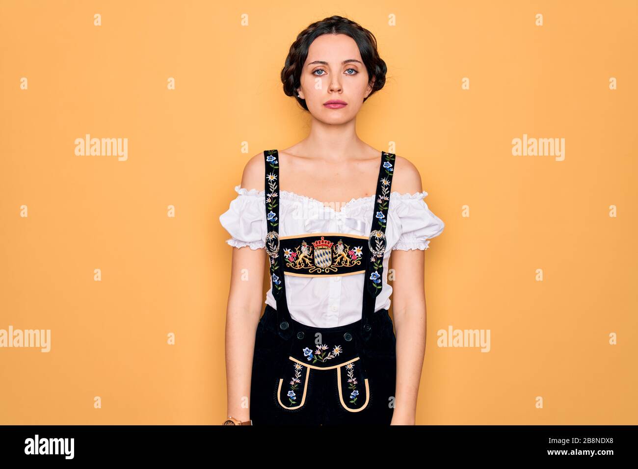 Young beautiful german woman with blue eyes wearing traditional ...