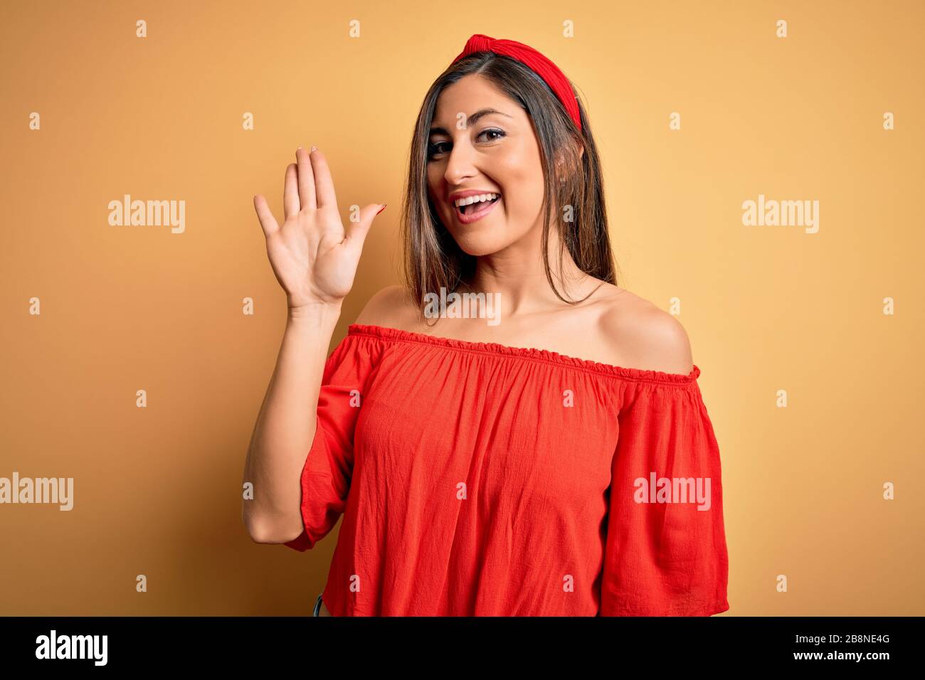 Young beautiful woman colorful summer style over yellow isolated ...