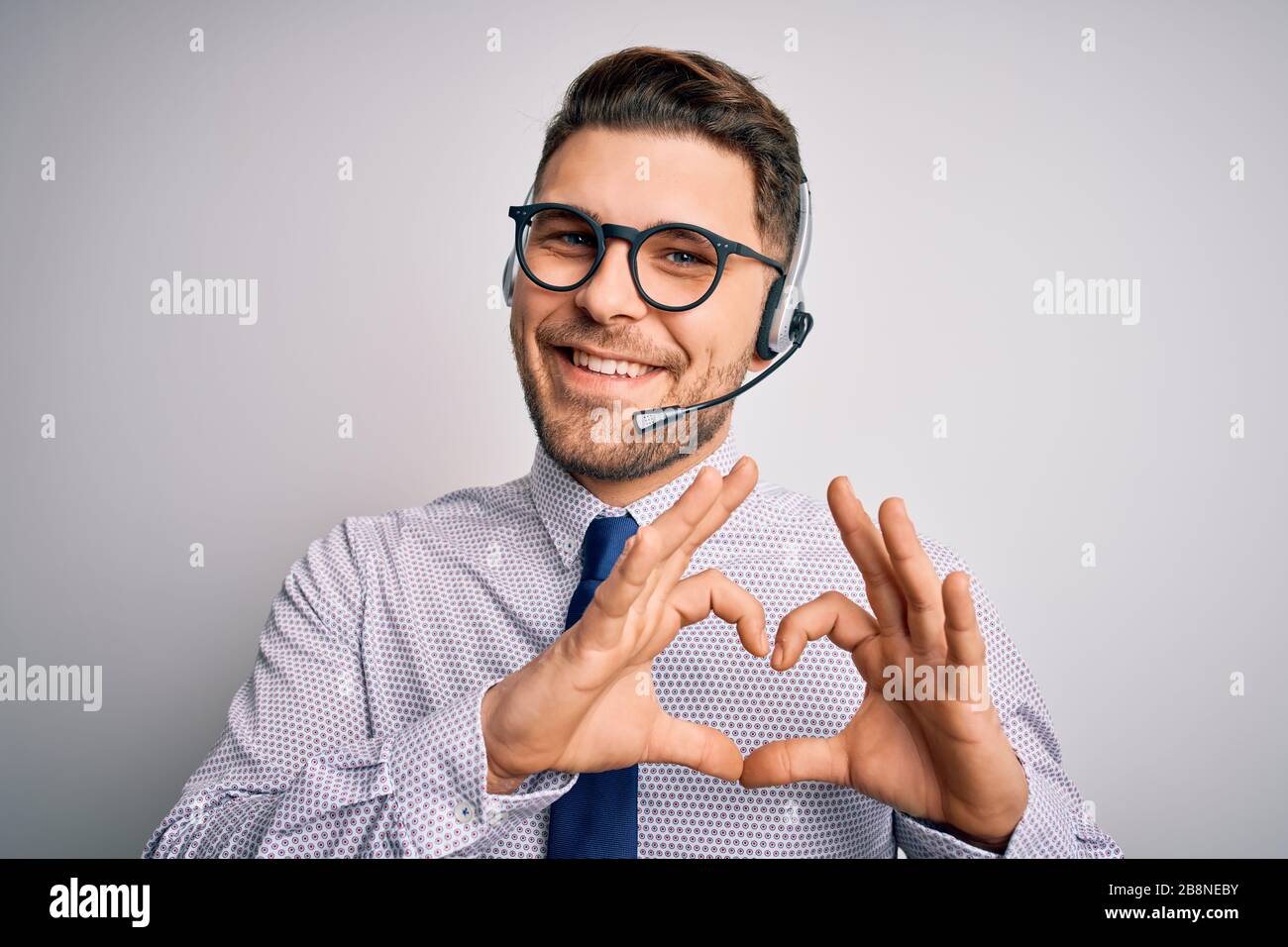 Young call center operator business man with blue eyes wearing glasses ...