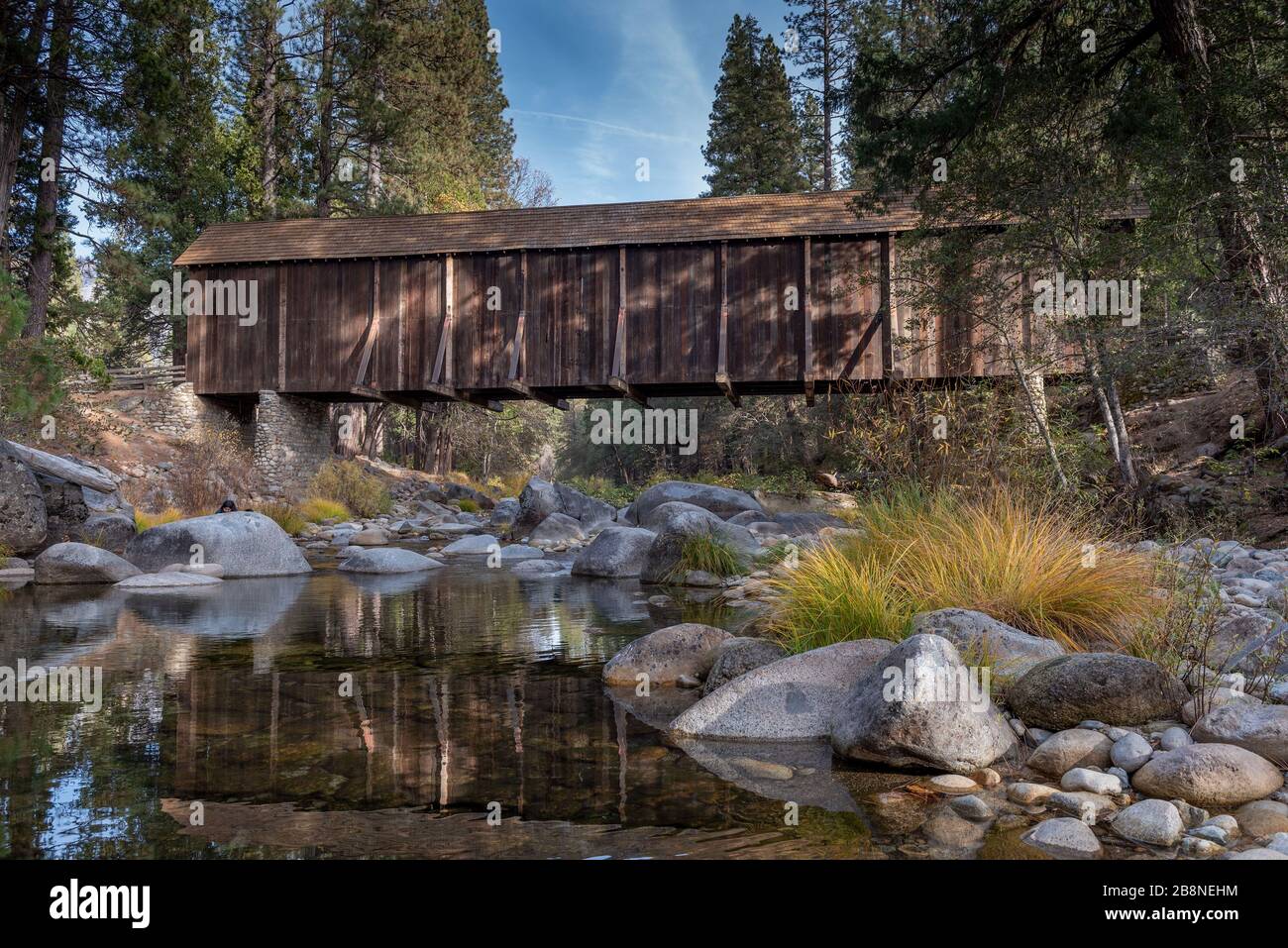 A view of Yosemite Wawona covered Bridge over the Merced River by ...
