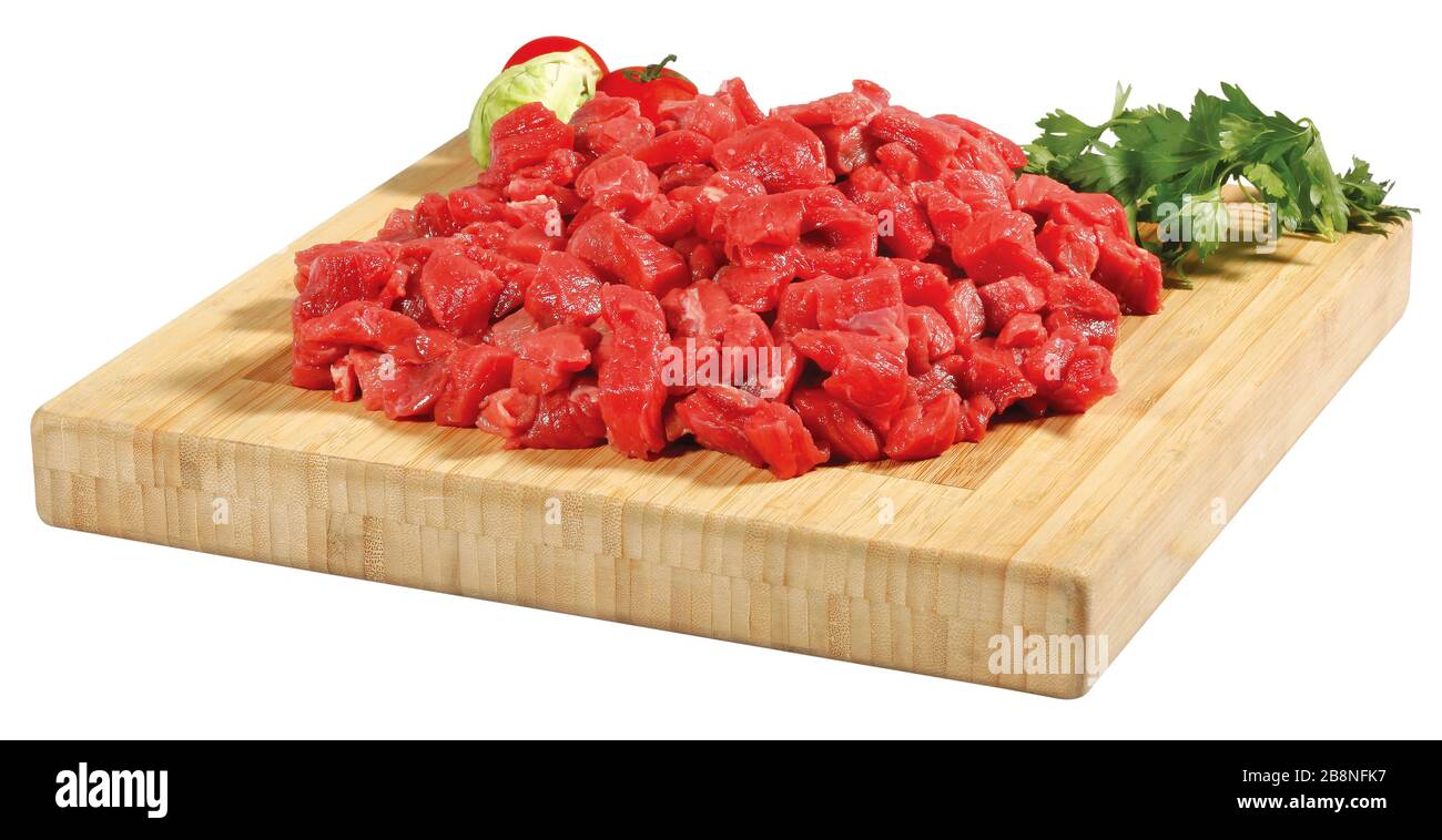 fresh raw red cubed meat chunk on wooden cut board isolated over white ...