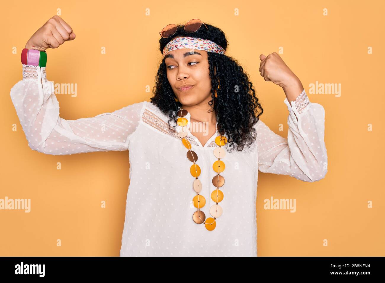 Young african american curly hippie woman wearing sunglasses and ...
