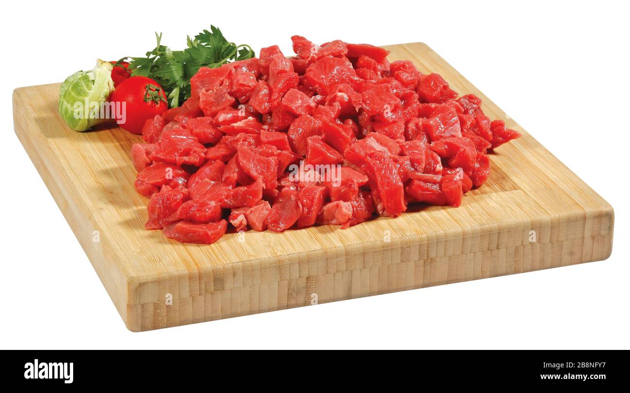 fresh raw red cubed meat chunk on wooden cut board isolated over white ...