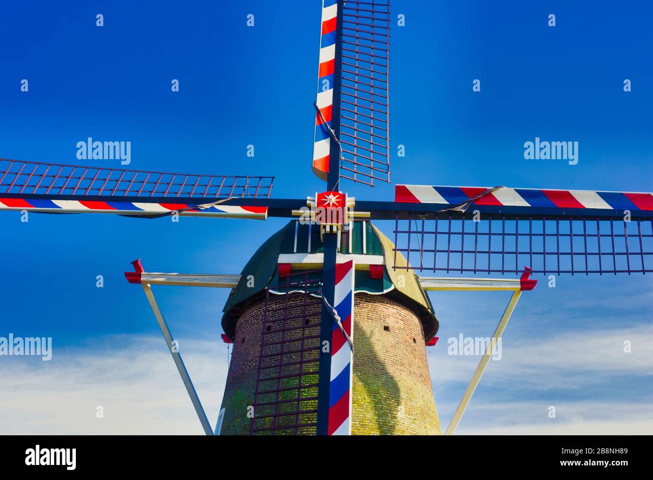 Traditional Dutch windmill under blue skies in The Netherlands, close ...