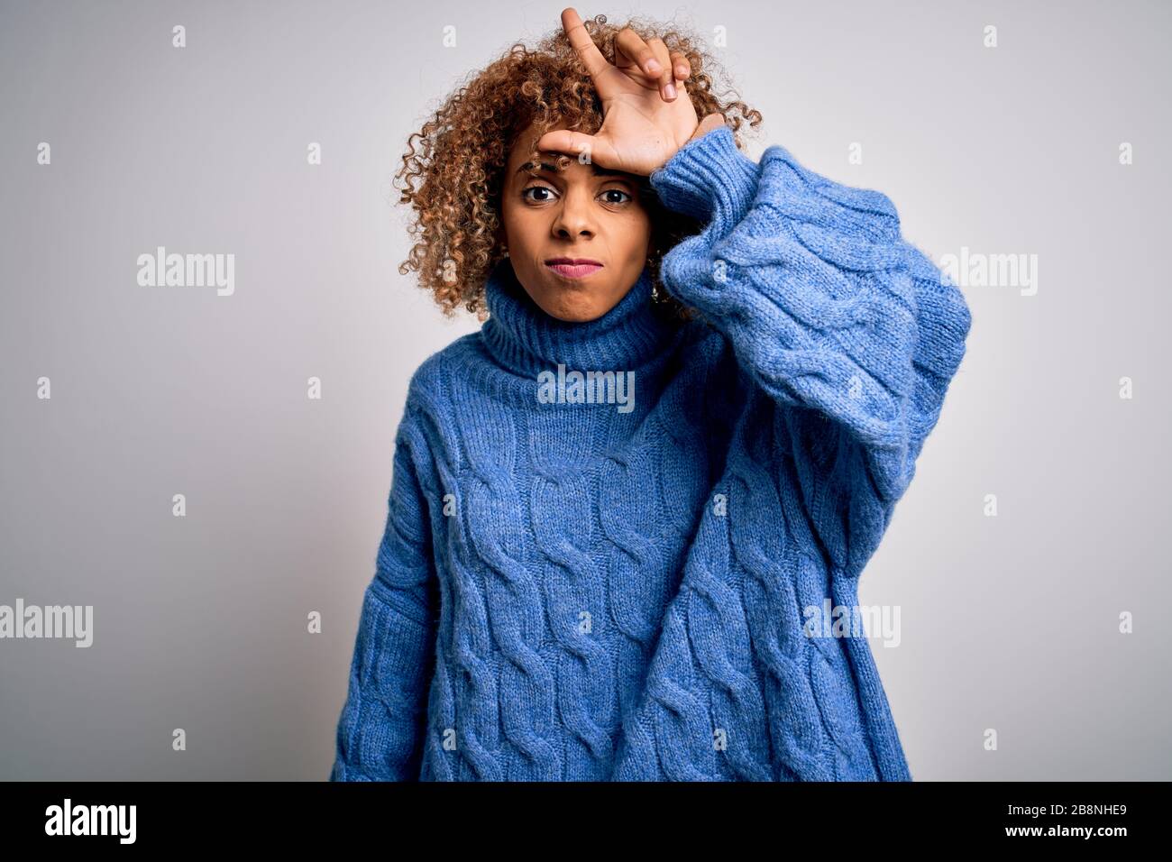 Young beautiful african american woman wearing turtleneck sweater over ...