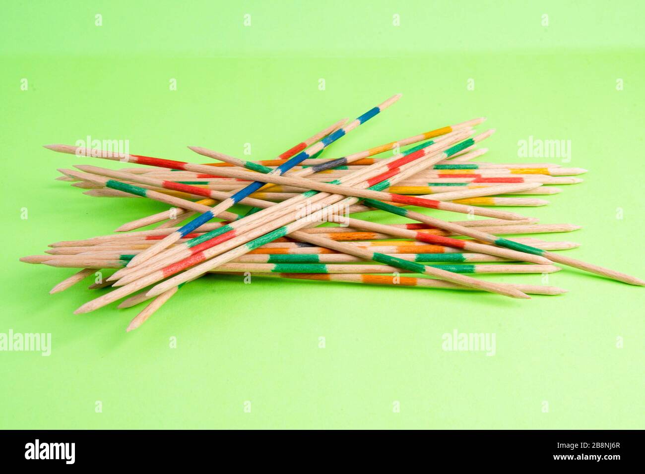 mikado game on green background with wooden sticks Stock Photo - Alamy