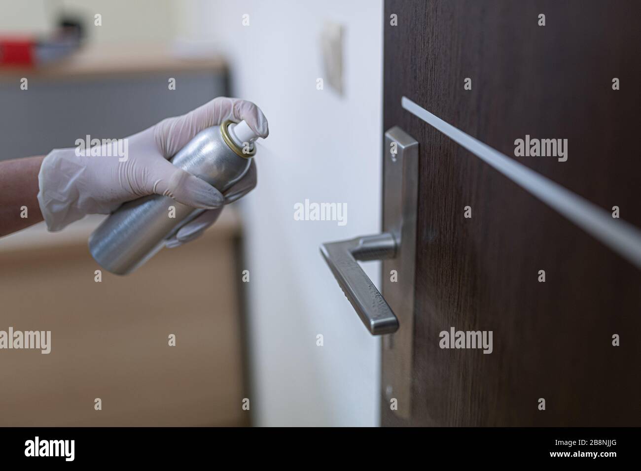 Spraying disinfectant alcohol door hi-res stock photography and images ...