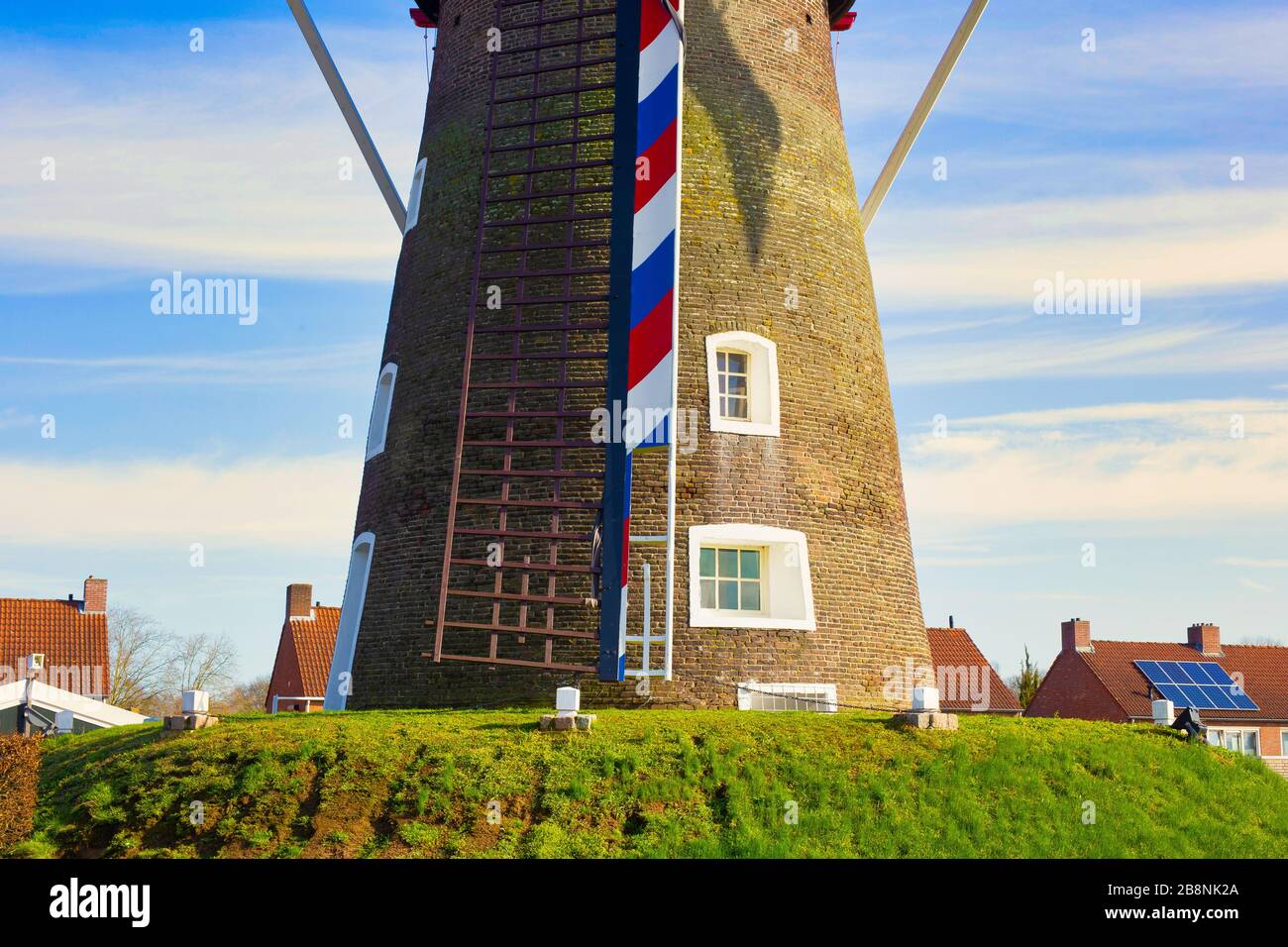 Traditional Dutch windmill under blue skies in The Netherlands, close ...