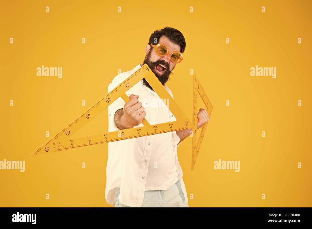 Smart student. Geometry teacher. Student using measuring instrument ...