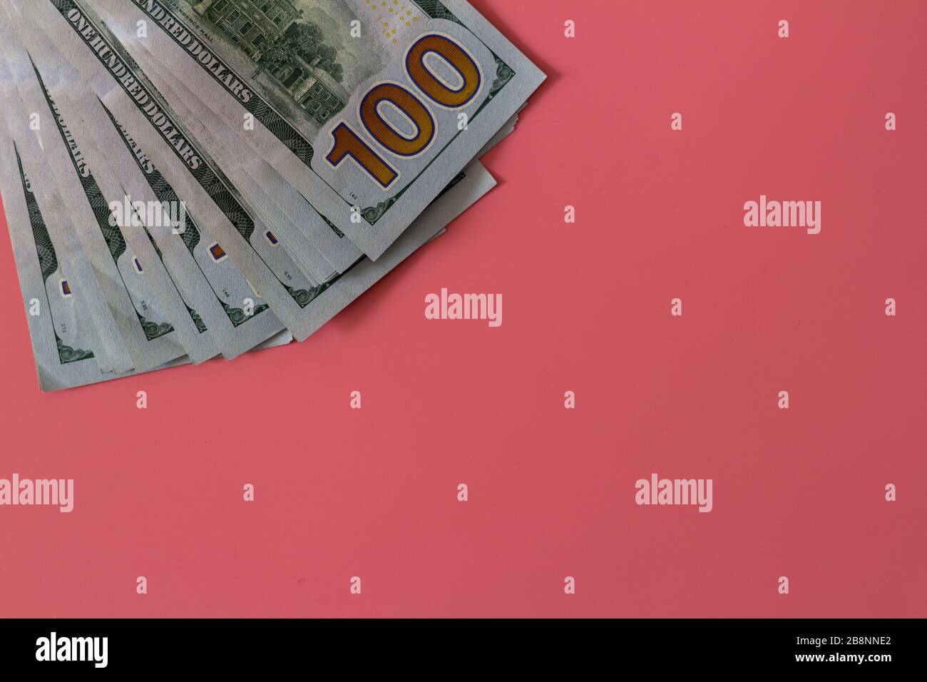 Flat closeup of dollars on pink background. Investment profit income ...