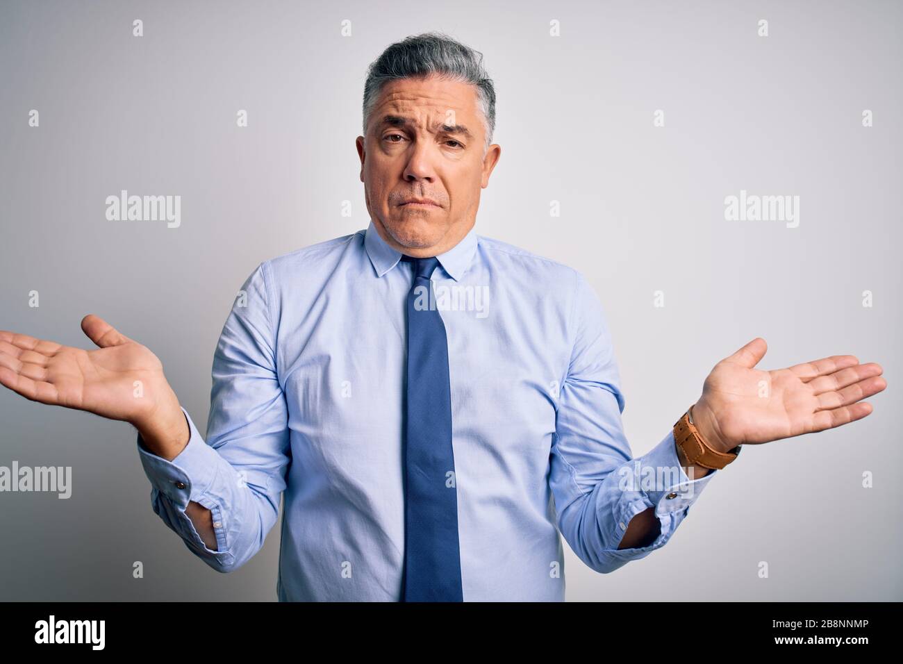 Middle age handsome grey-haired business man wearing elegant shirt and ...