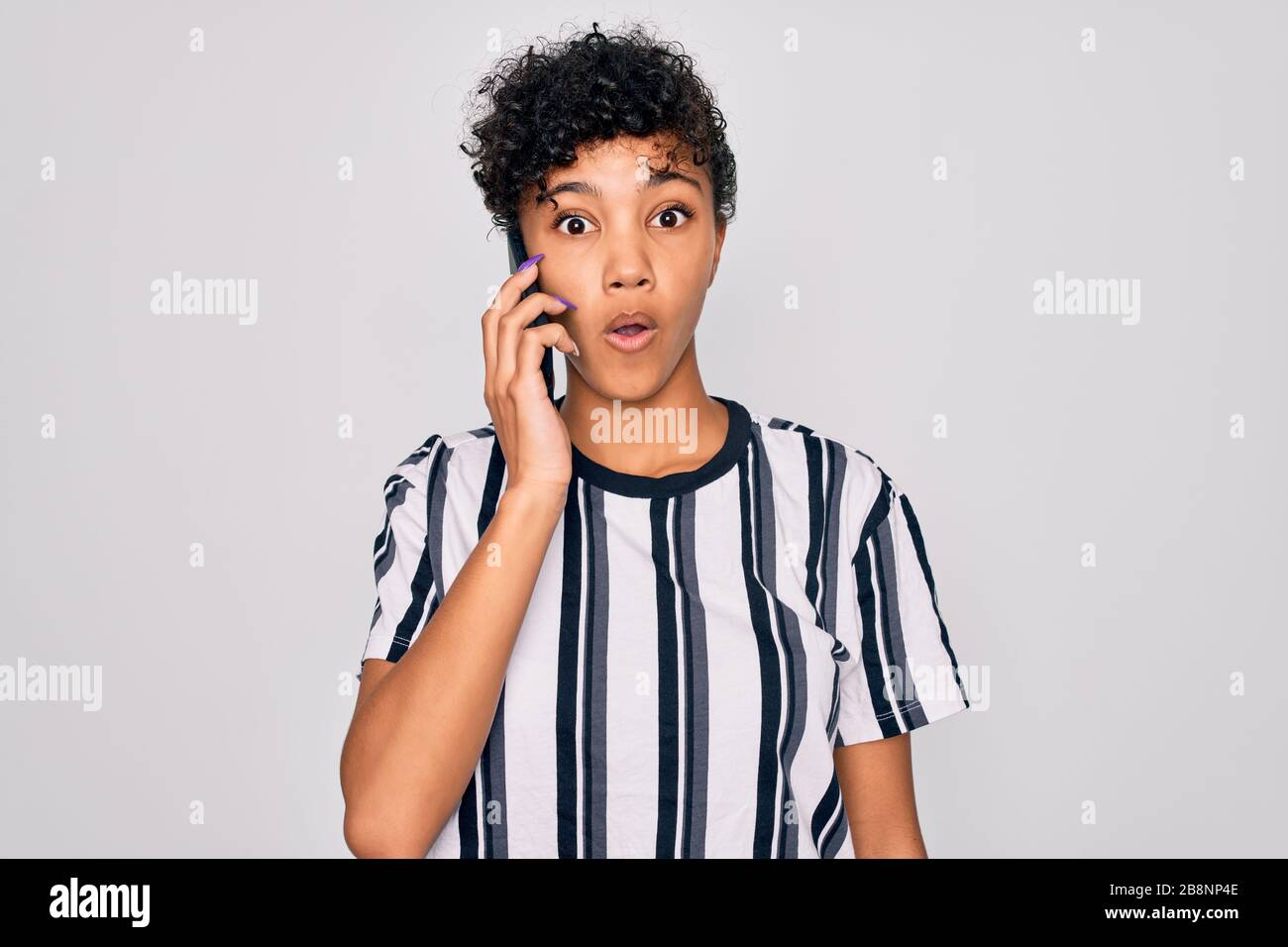 Young beautiful african american afro woman having conversation talking ...