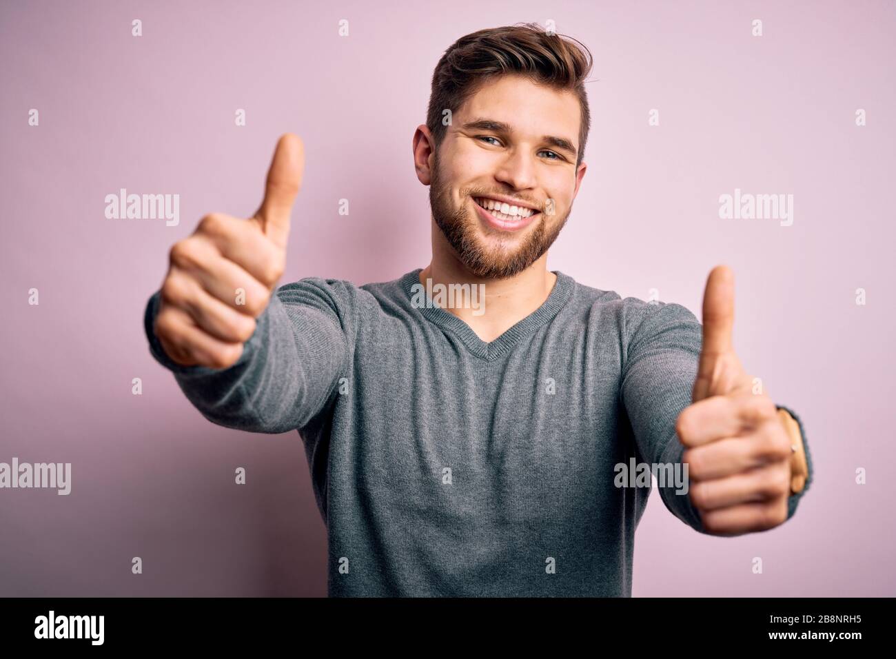 Young handsome blond man with beard and blue eyes wearing casual ...