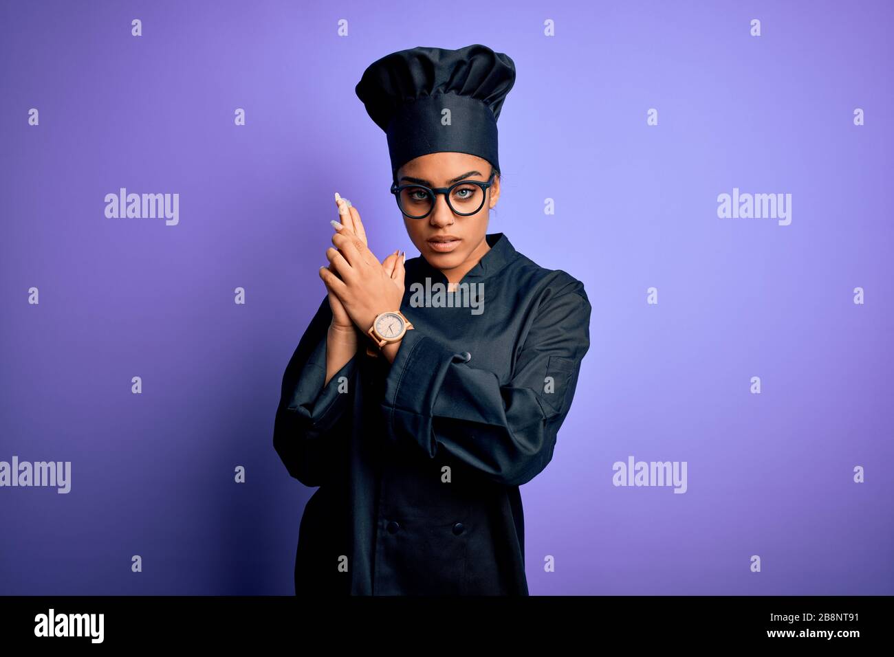 Young african american chef girl wearing cooker uniform and hat over ...