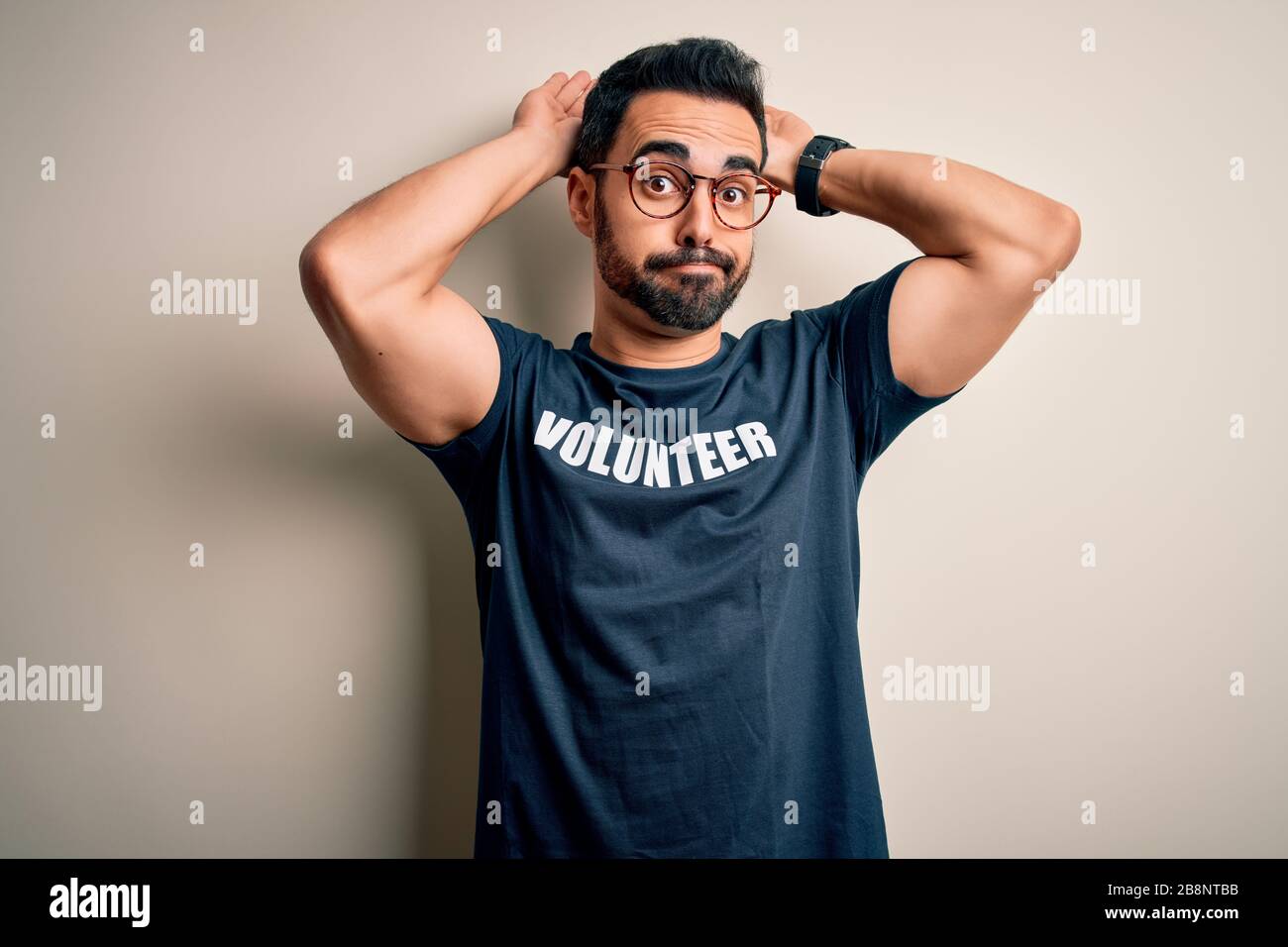 Handsome man with beard wearing t-shirt with volunteer message over ...
