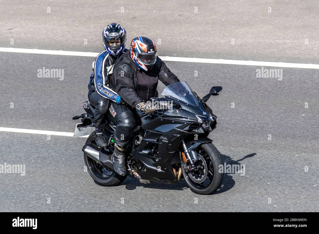 Kawasaki Ninja motorbike rider; Vehicular traffic, two wheeled ...