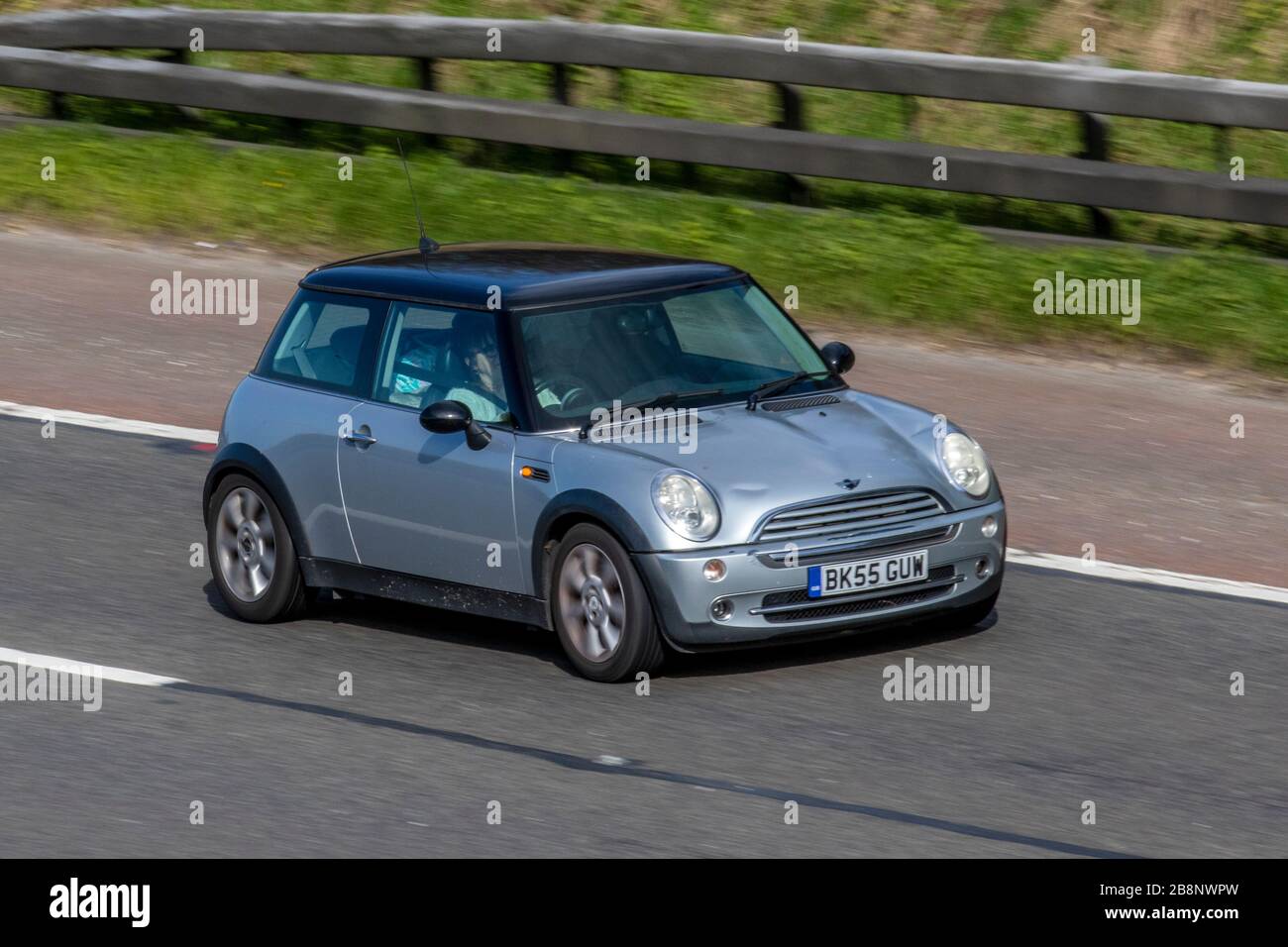 2005 grey Mini Cooper; UK vehicular traffic, transport, moving vehicles ...
