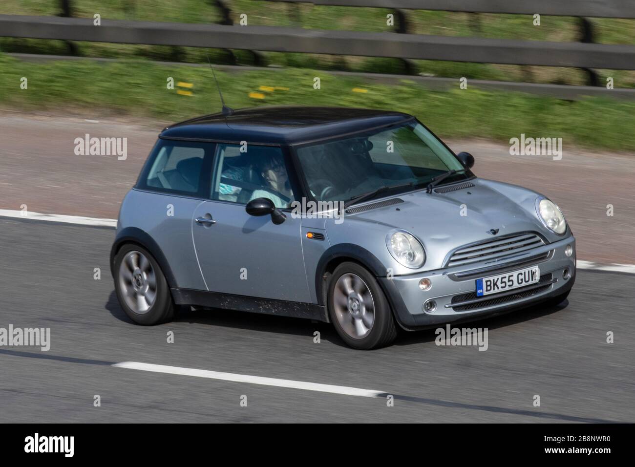 2005 grey Mini Cooper; UK vehicular traffic, transport, moving vehicles ...