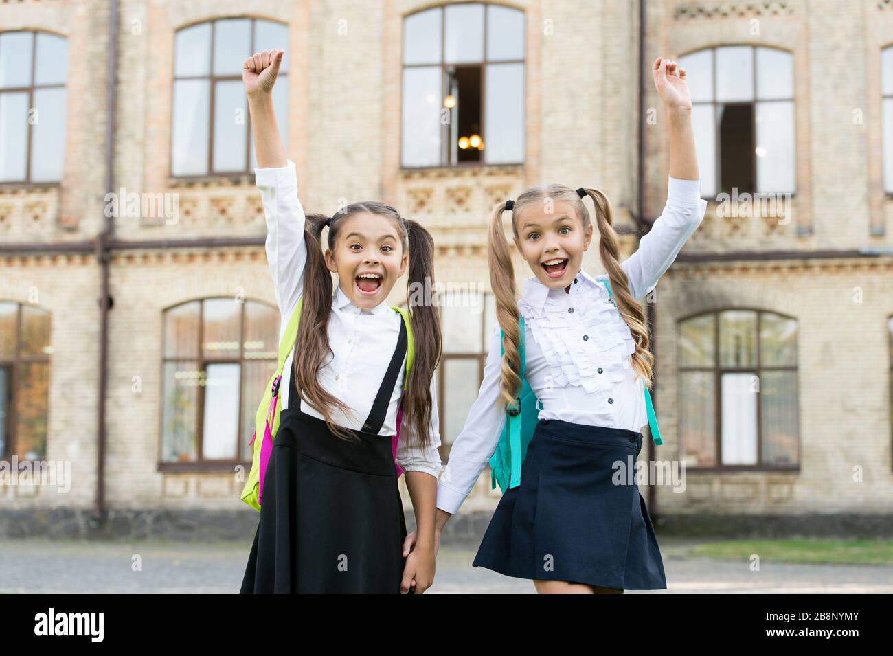 Celebrate last day of school year. Happy children celebrate outdoors ...
