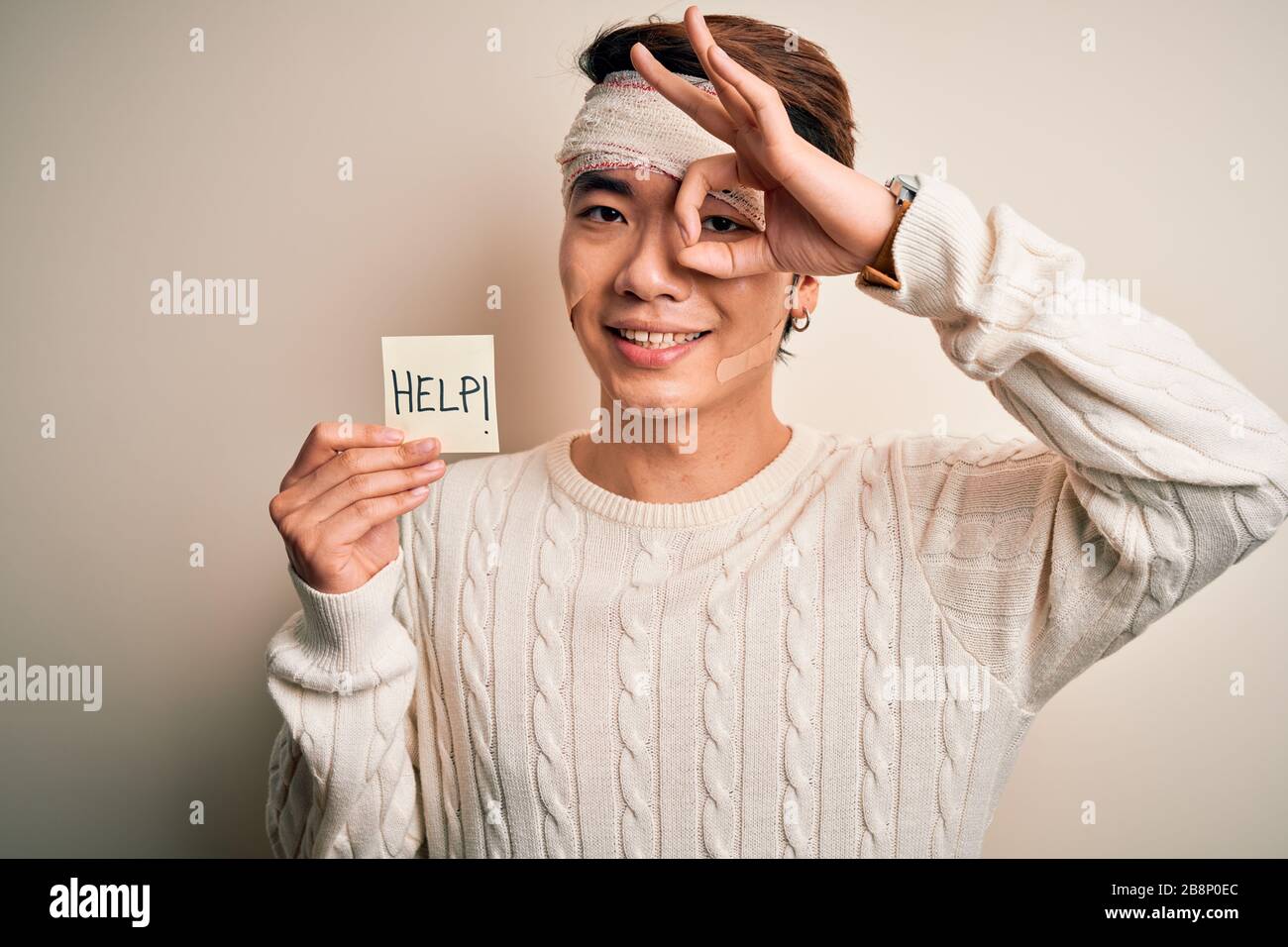 Young handsome chinese man injured for accident wearing bandage on head ...