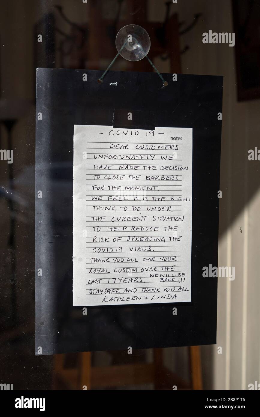 Handwritten notice on a small business in Edinburgh informing customers ...